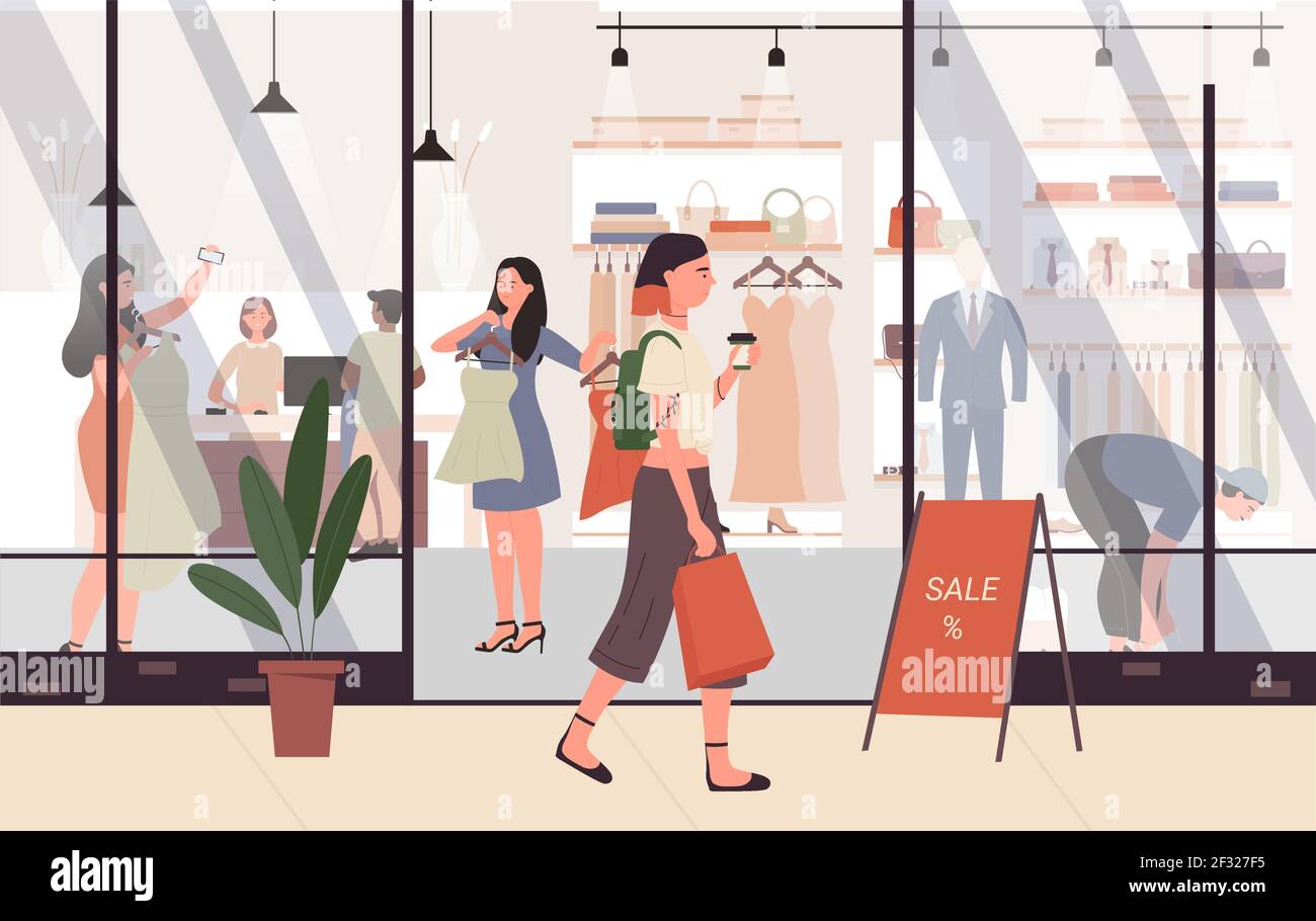 Female fashion sales at shopping mall, young woman walking next to shop ...