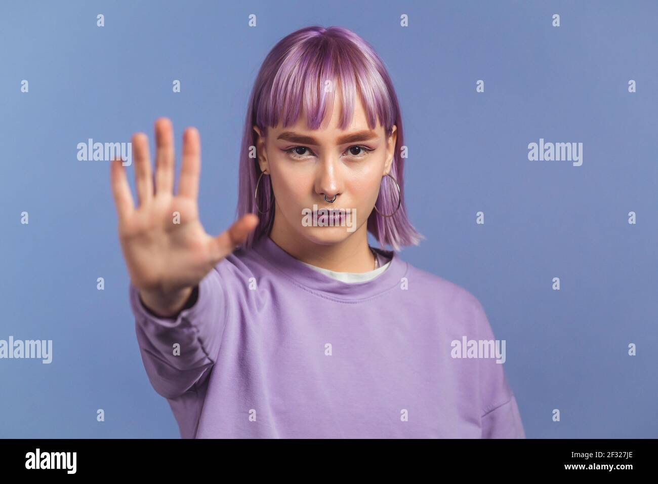 Pretty woman disapproving with NO hand sign gesture. Denying, rejecting ...