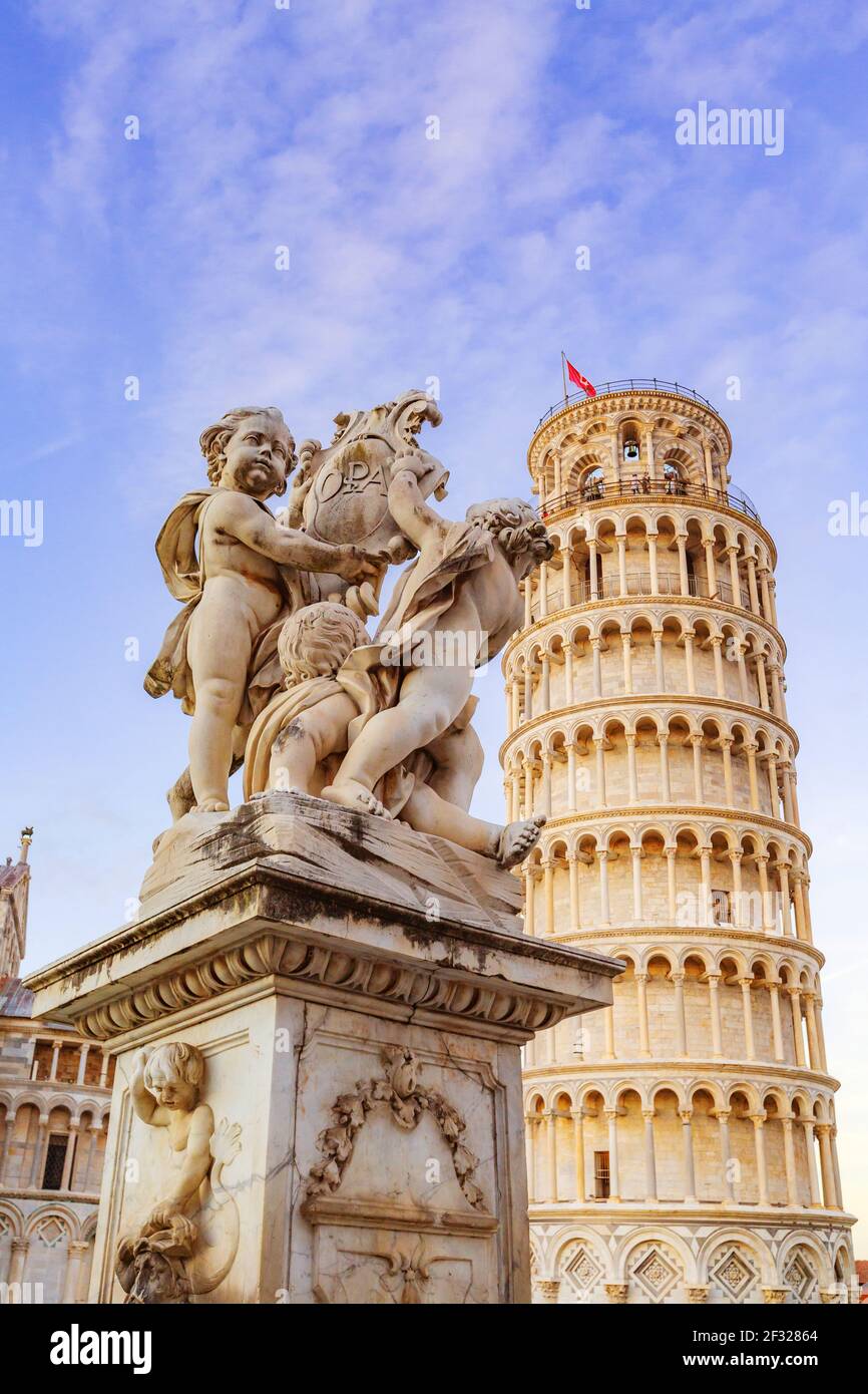 Statue of angels on Square of Miracles in Pisa and Leaning Tower, Italy ...