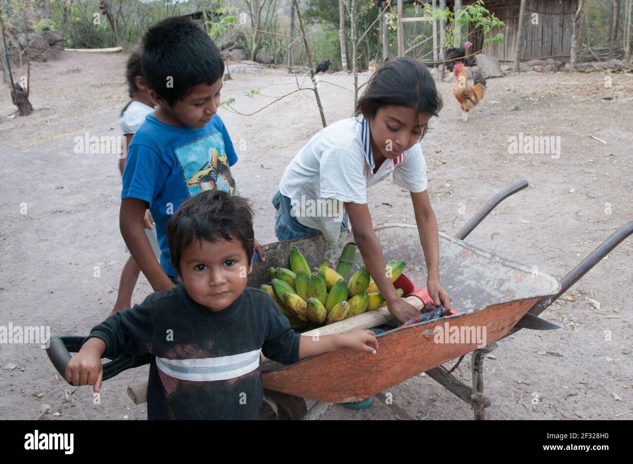 Rivas, Nicaragua. 07-15-2016. Portrait of children with a wheelbarrow ...