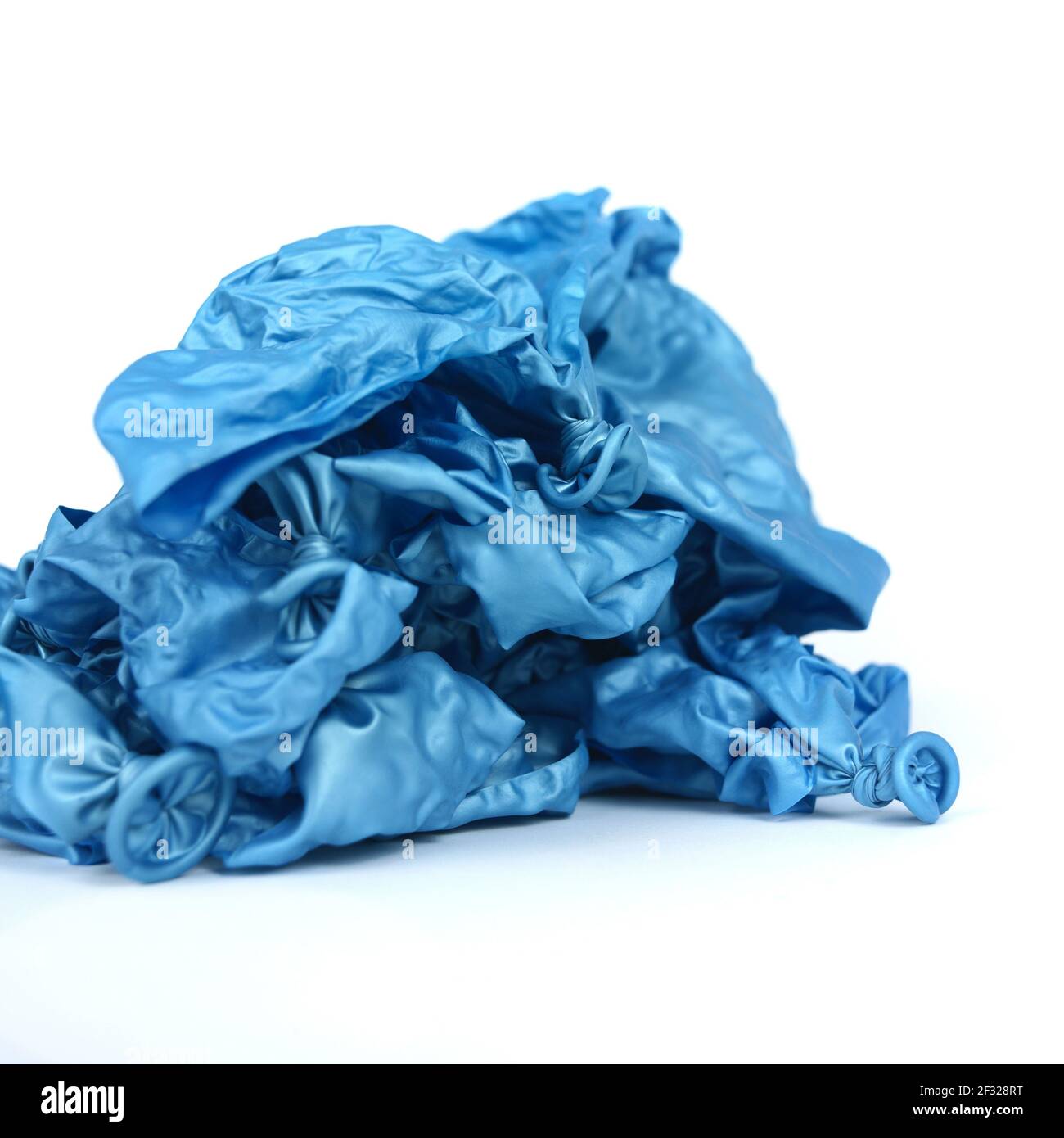 The deflated blue balloons isolated on white background Stock Photo - Alamy