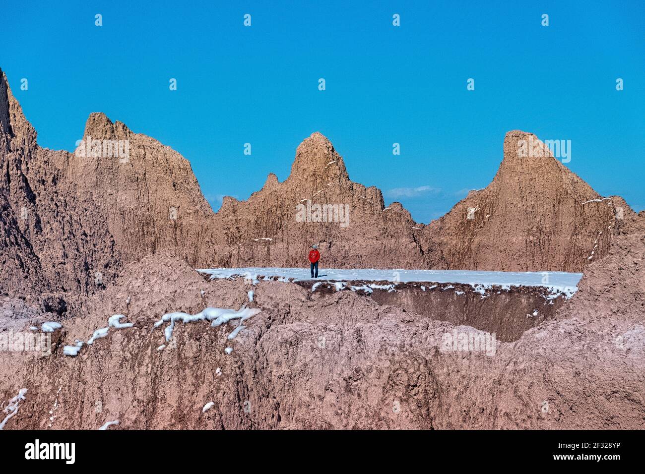 Hiker on the Castle Trail, Badlands National Park, South Dakota, U.S.A ...