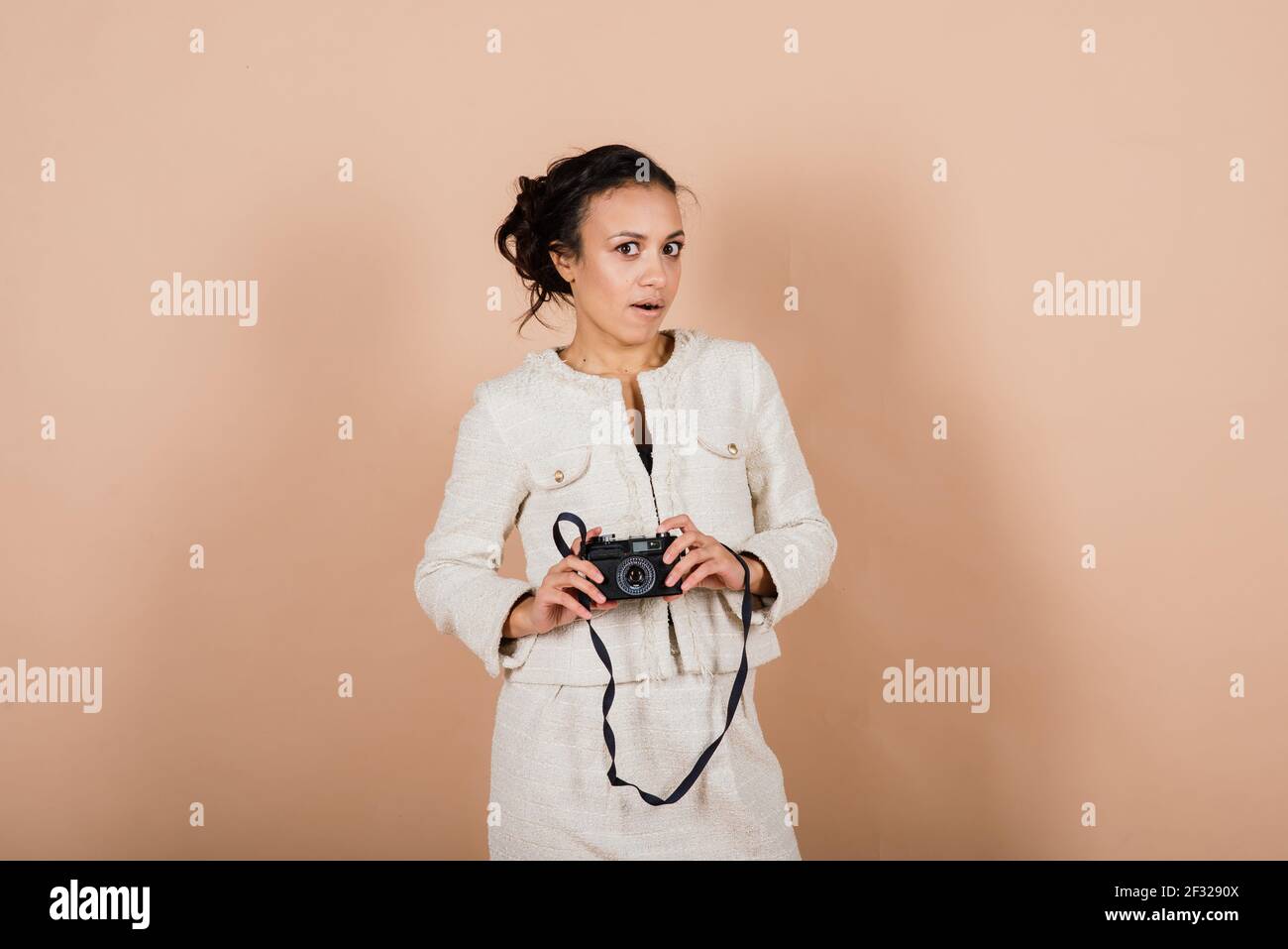 Attractive african american black female, using a slr digital camera ...