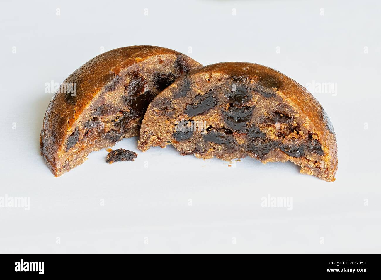 Christmas pudding cut in half isolated on a white background Stock ...
