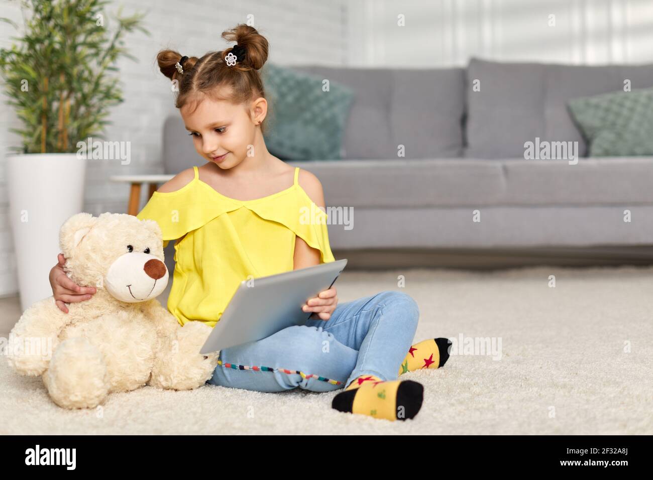 little child girl using digital tablet Stock Photo - Alamy