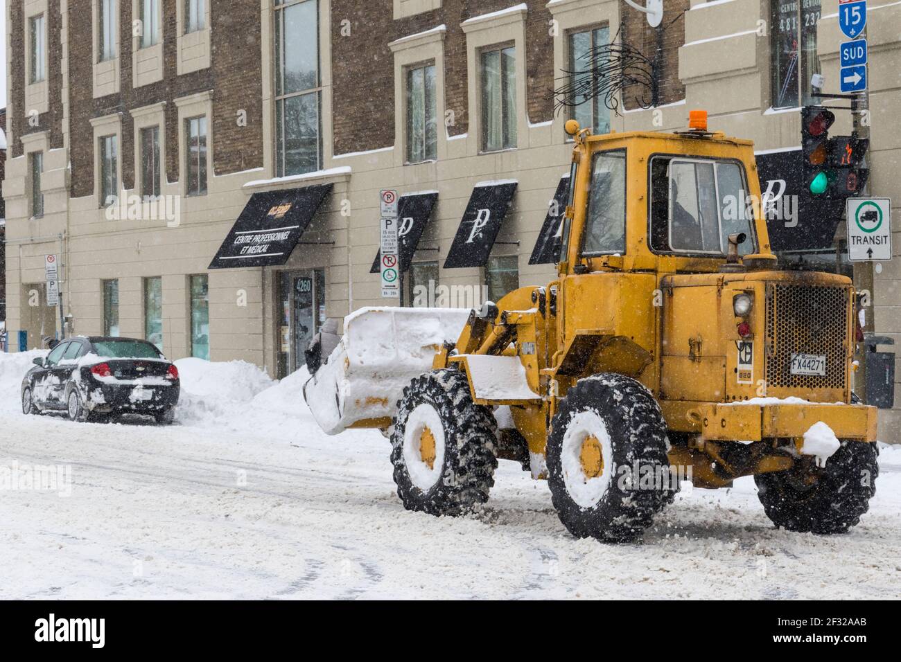 snow plow moving snow after snowstorm, March 2017, Montreal, QC Stock ...