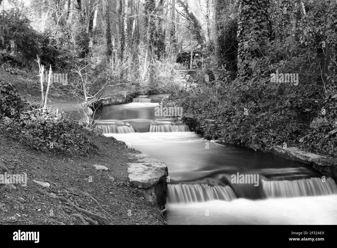 Rushing water in waterfall rapids captured in long exposure as water ...