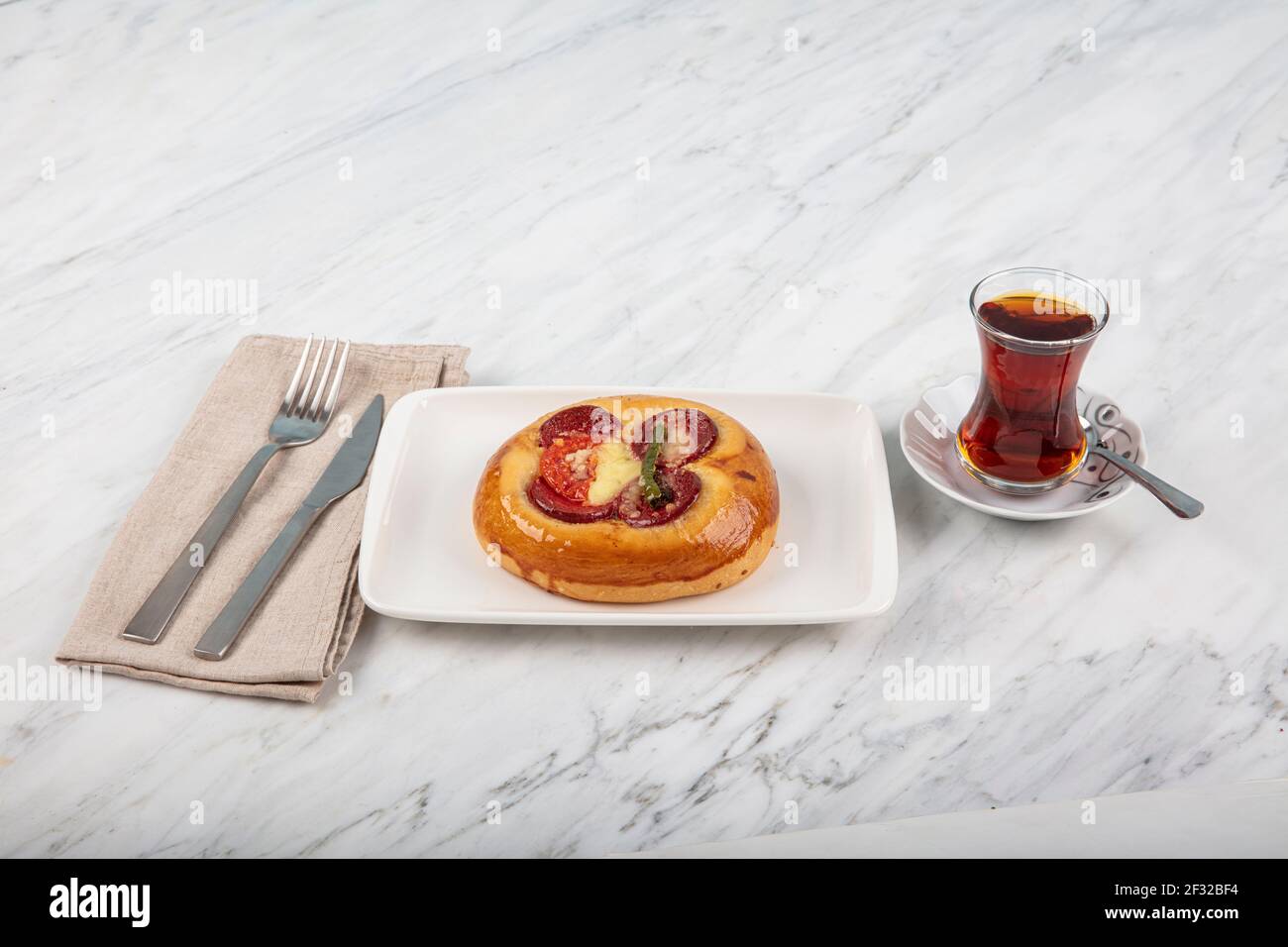 Turkish cuisine Sausage Mini Pizza. Puff pastry mini pizza with tomato ...
