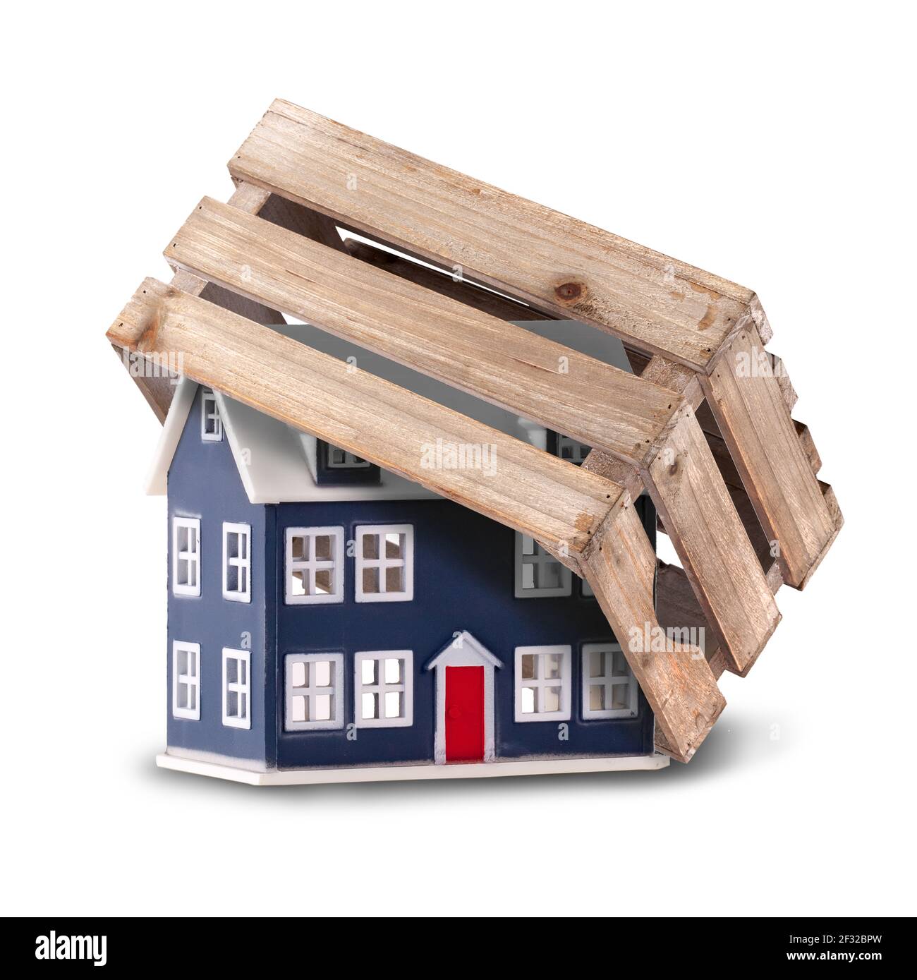 Home protection and security concept with a small house protected with ...