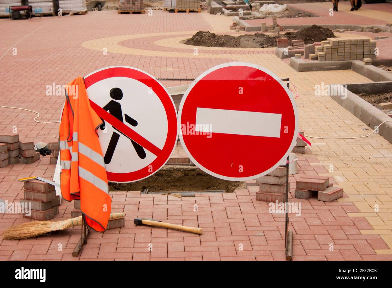 Paving slabs laying works. Prohibitory road signs. Repair of the ...