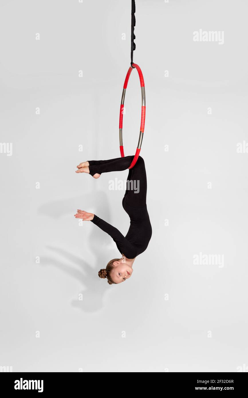 Girl gymnast shows an acrobatic performance Stock Photo - Alamy
