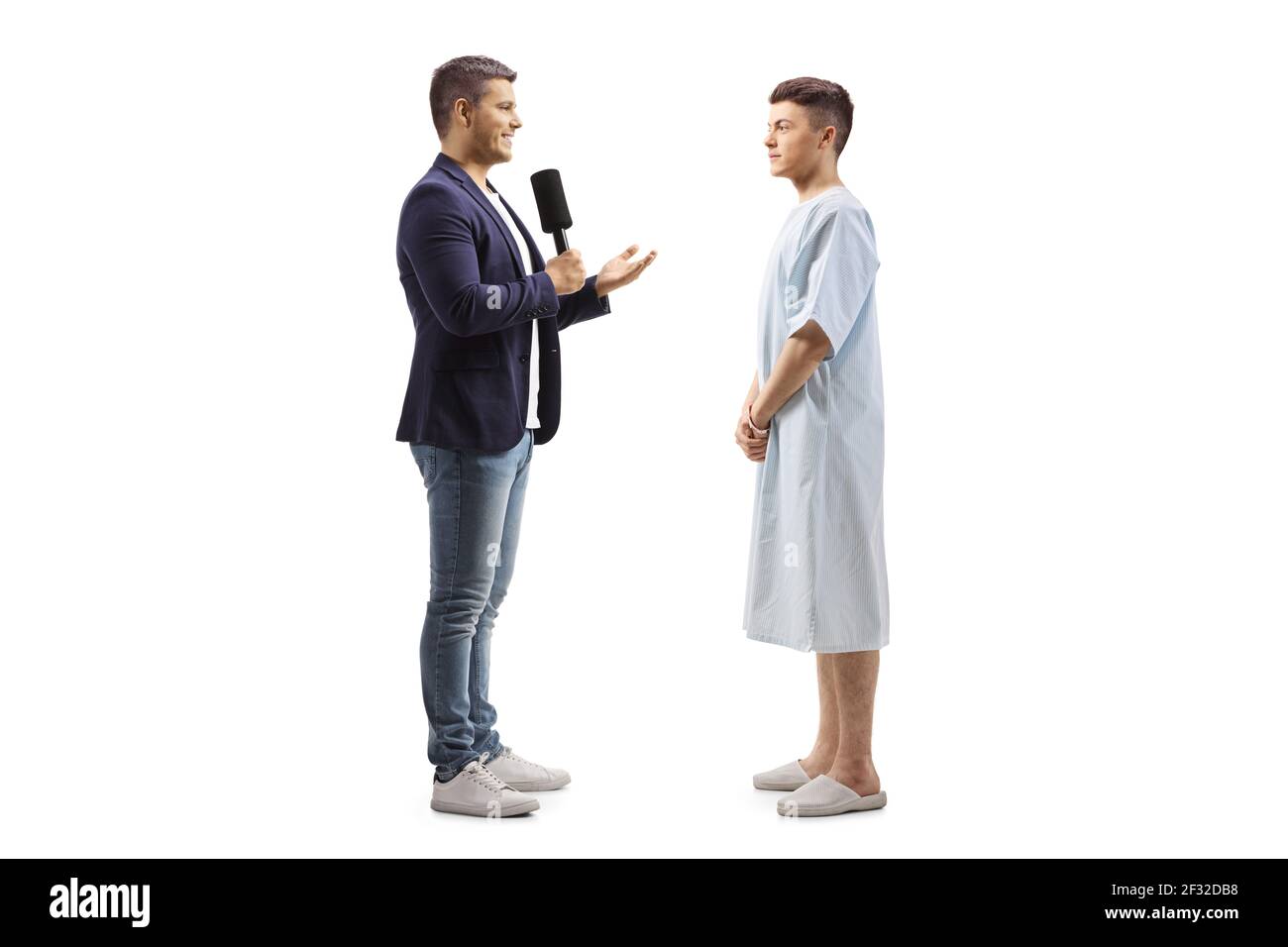 Reporter interviewing a young male patient in a hospital gown isolated ...
