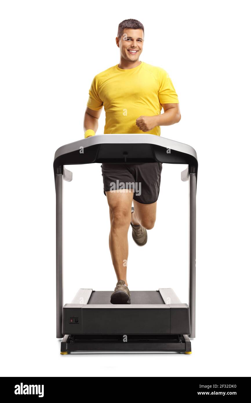 Full length portrait of a man in sportswear running on a treadmill and ...