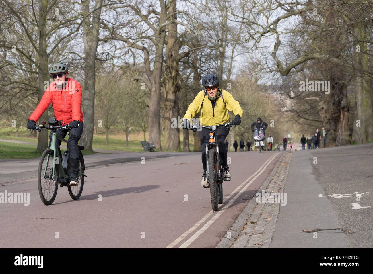 man and woman cyclists ride side-by-side Stock Photo - Alamy