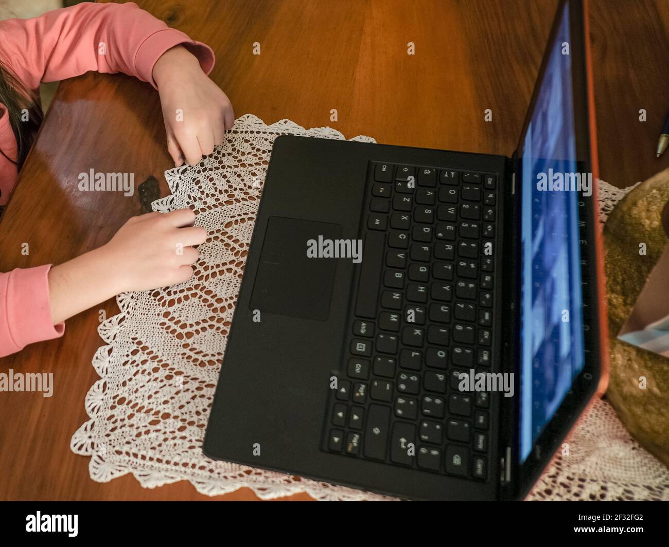 Child girl using laptop device for smart remote schooling in video call ...