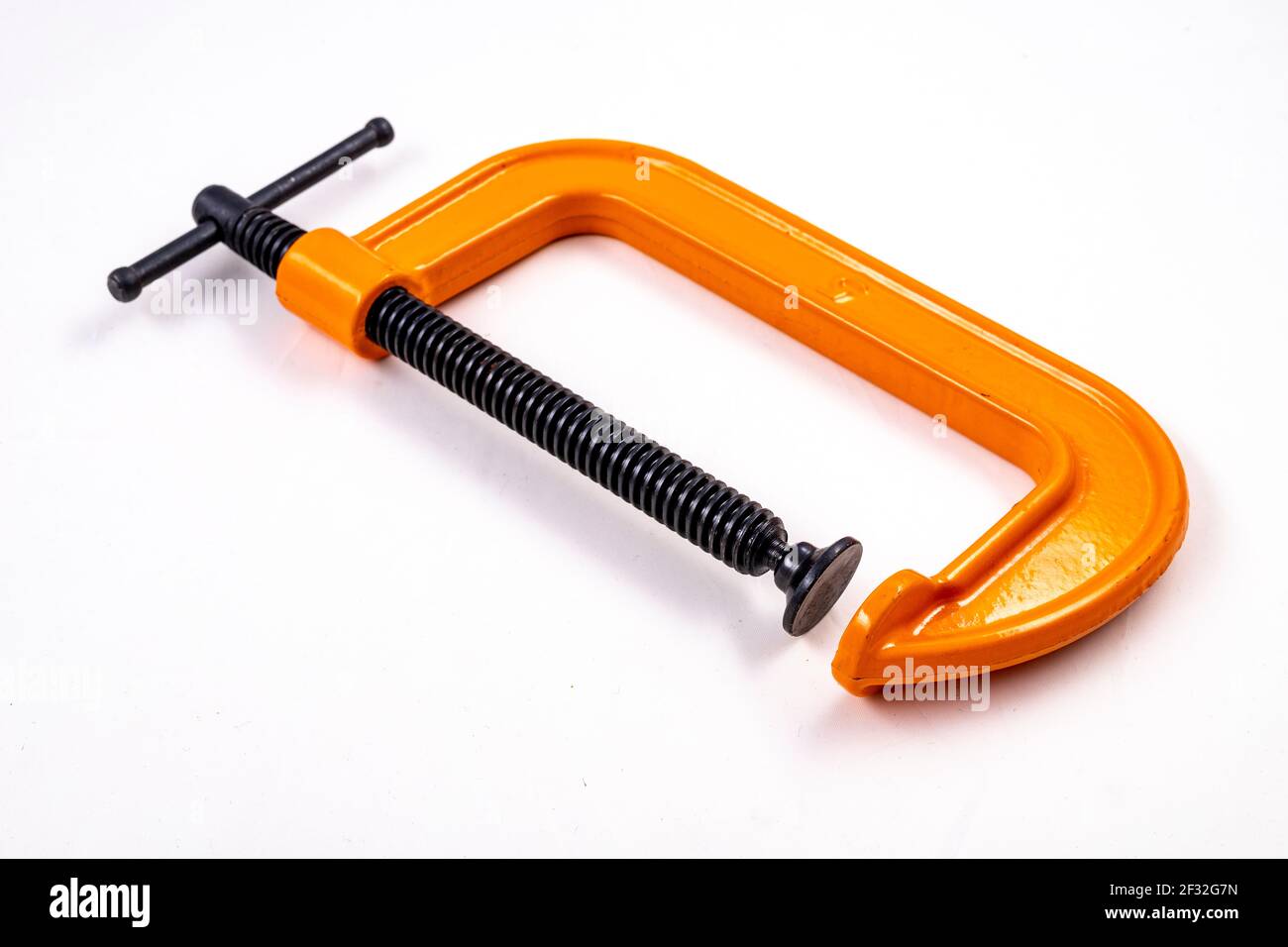 Carpenter's clamp used in a carpentry shop. Metal joinery accessories ...