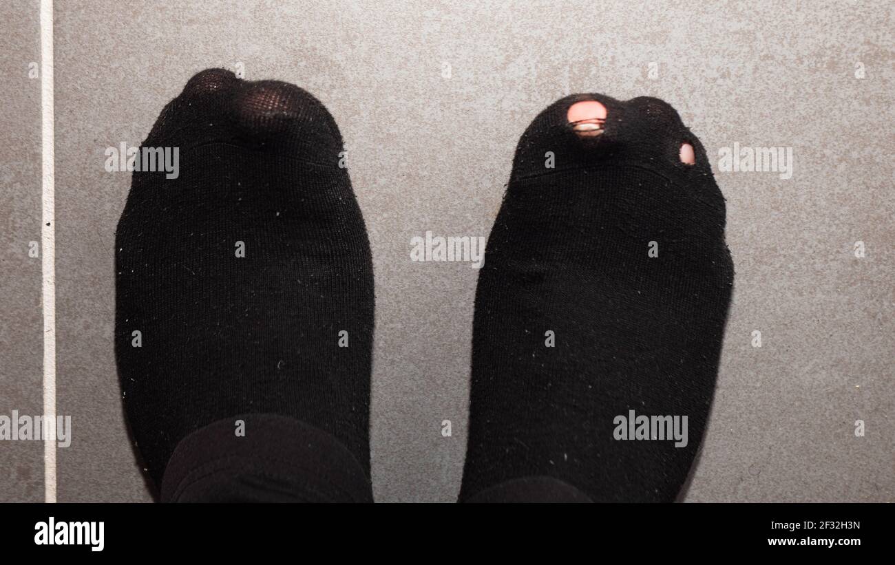 Hole in sock hi-res stock photography and images - Alamy