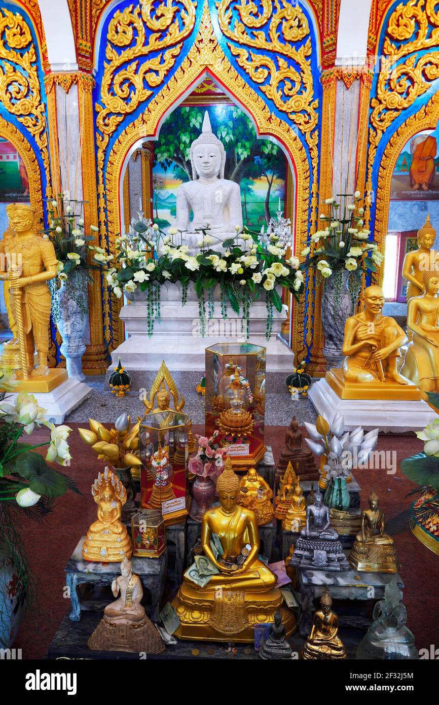 Interior with Buddha statues, Wat Chalong, temple on Phuket, Thailand ...