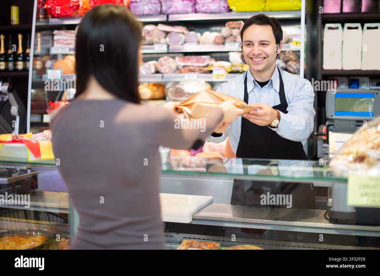 Serving a customer hi-res stock photography and images - Alamy