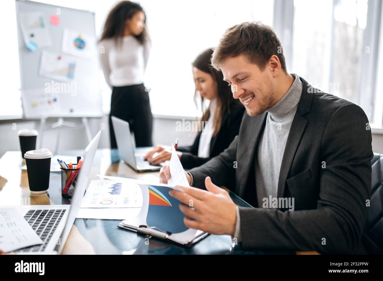 Portrait positive male designer doing hi-res stock photography and ...