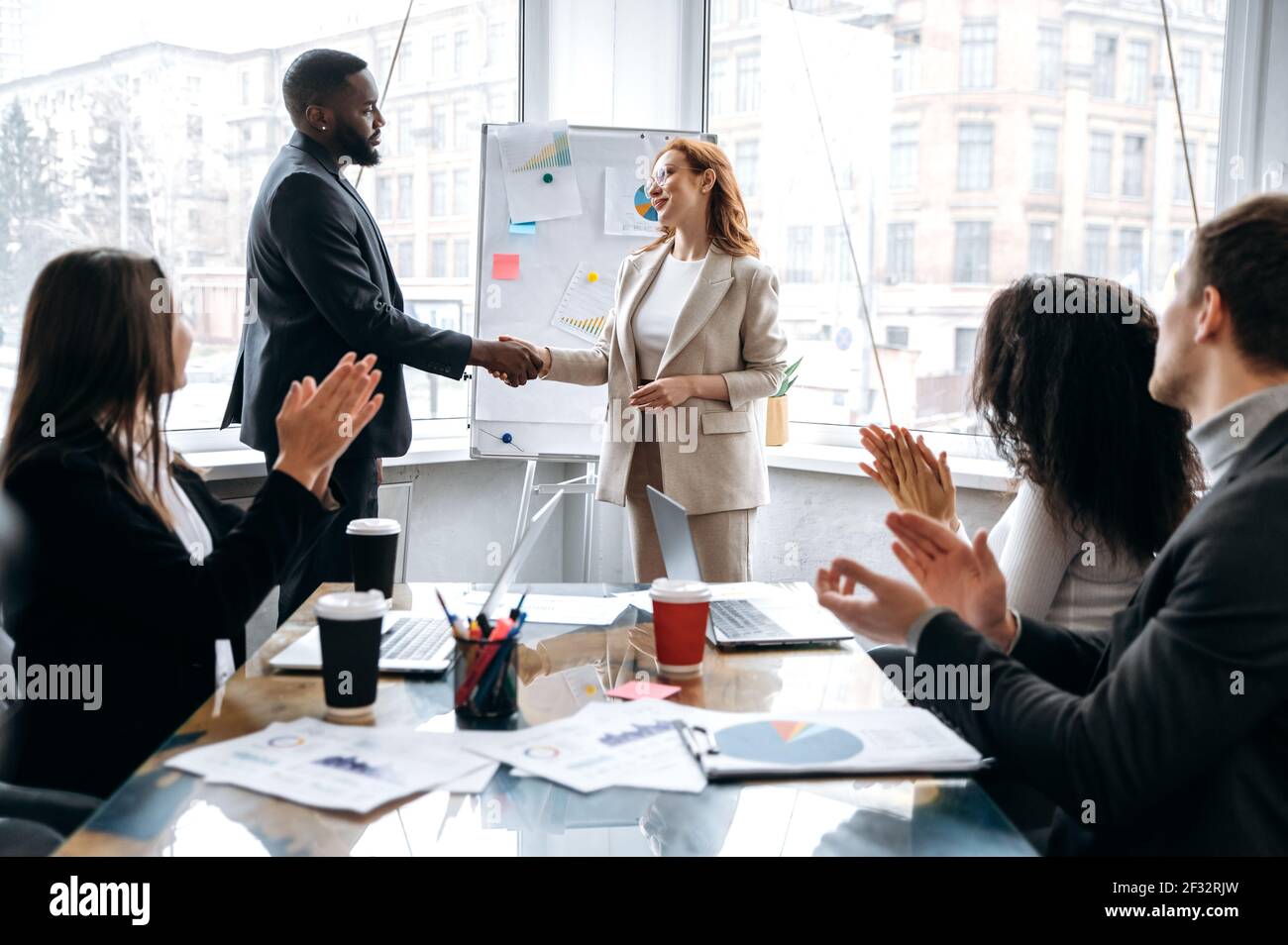 Concept of successful negotiations. Influential mixed race business ...