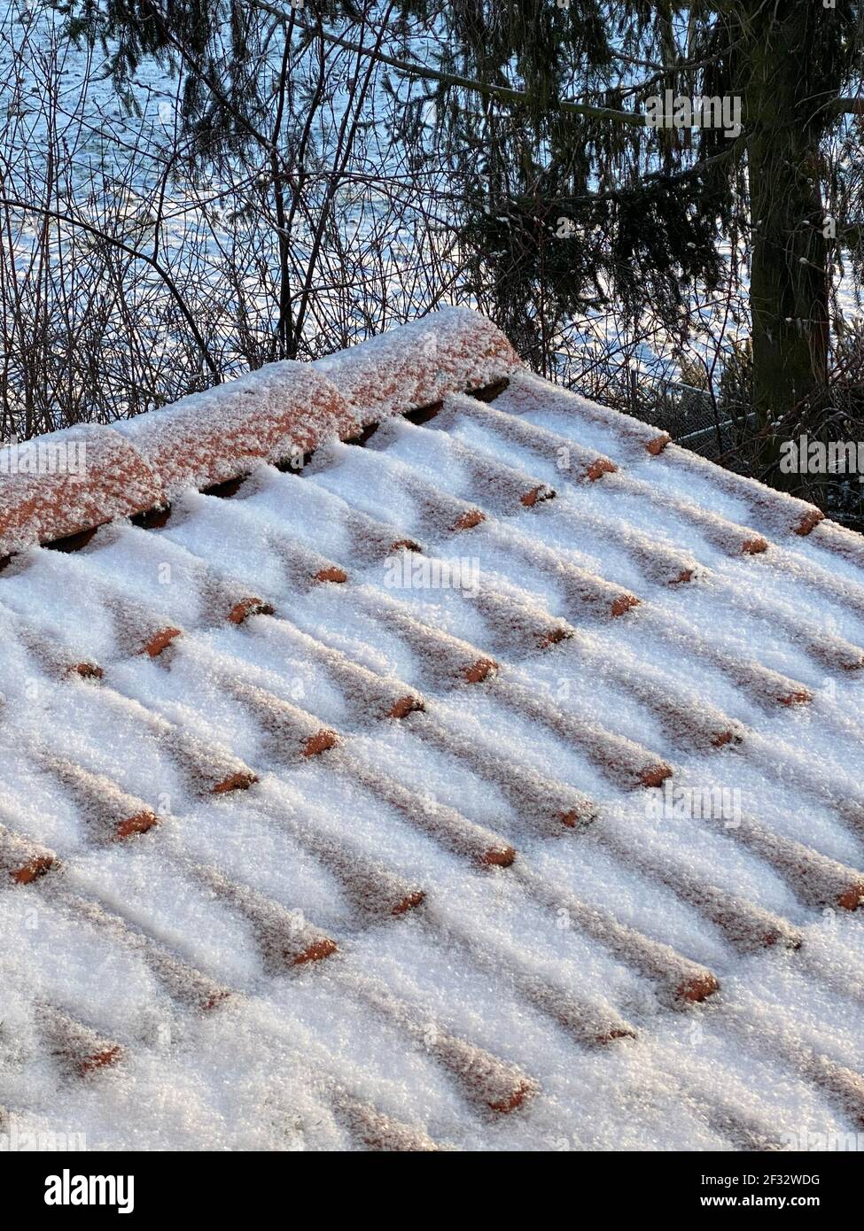 Tiled Roof Covered With Snow Stock Photo - Alamy