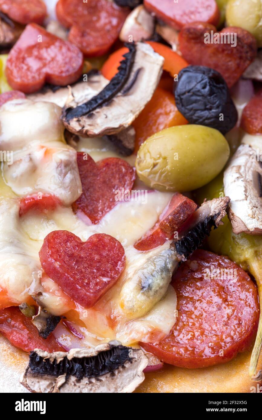 Heart Shaped Salami On A Pizza Stock Photo - Alamy