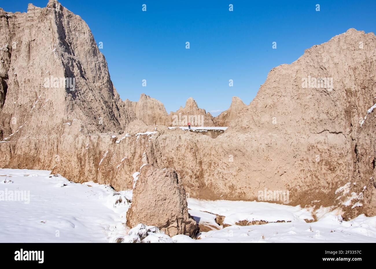 A hiker on the Castle Trail, Badlands National Park, South Dakota, U.S ...