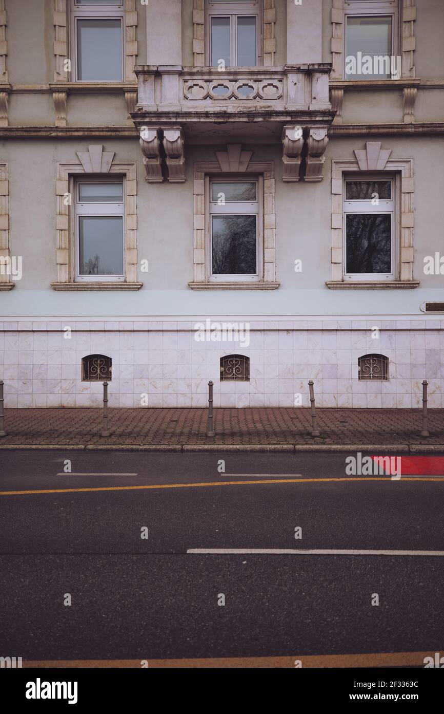 A vertical shot of a beautiful European building and a street that goes ...