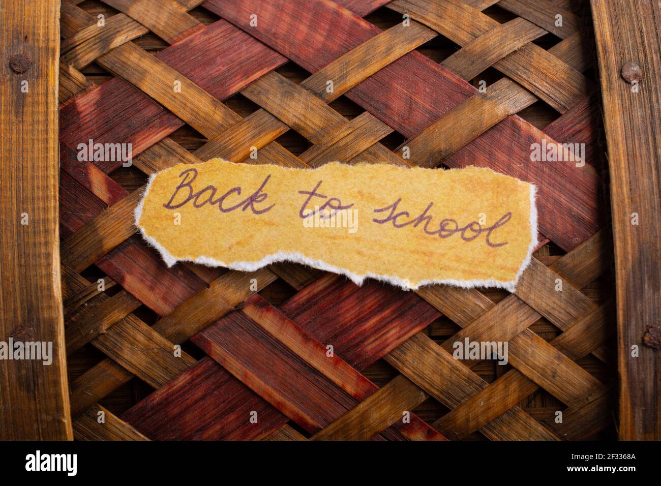Back to school wording on a piece of torn paper Stock Photo - Alamy