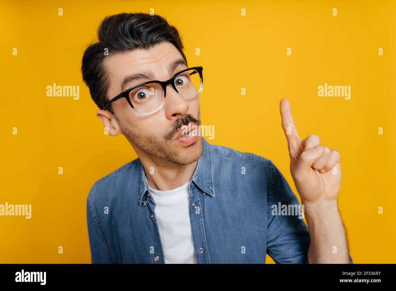 Distorted portrait of amazed surprised caucasian guy in a glasses and ...