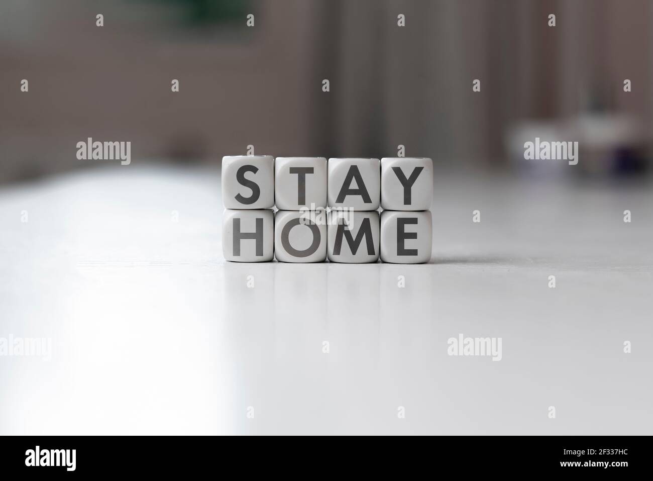 stay safe at home during quarantine. dice cubes with text, simple ...