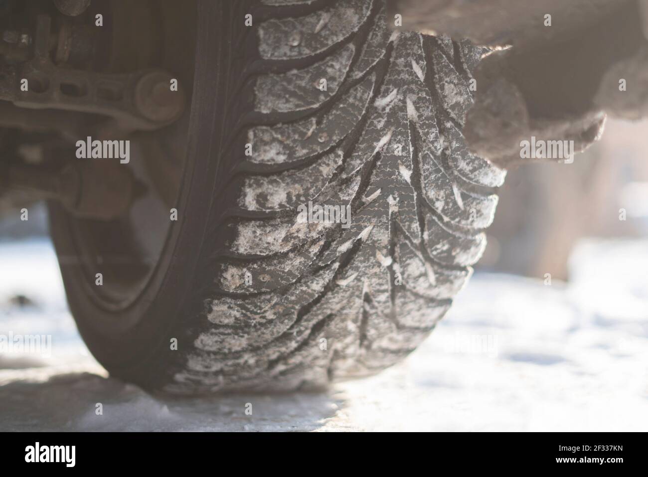 snow and ice winter car tyres. close up auto vehicle wheel Stock Photo ...