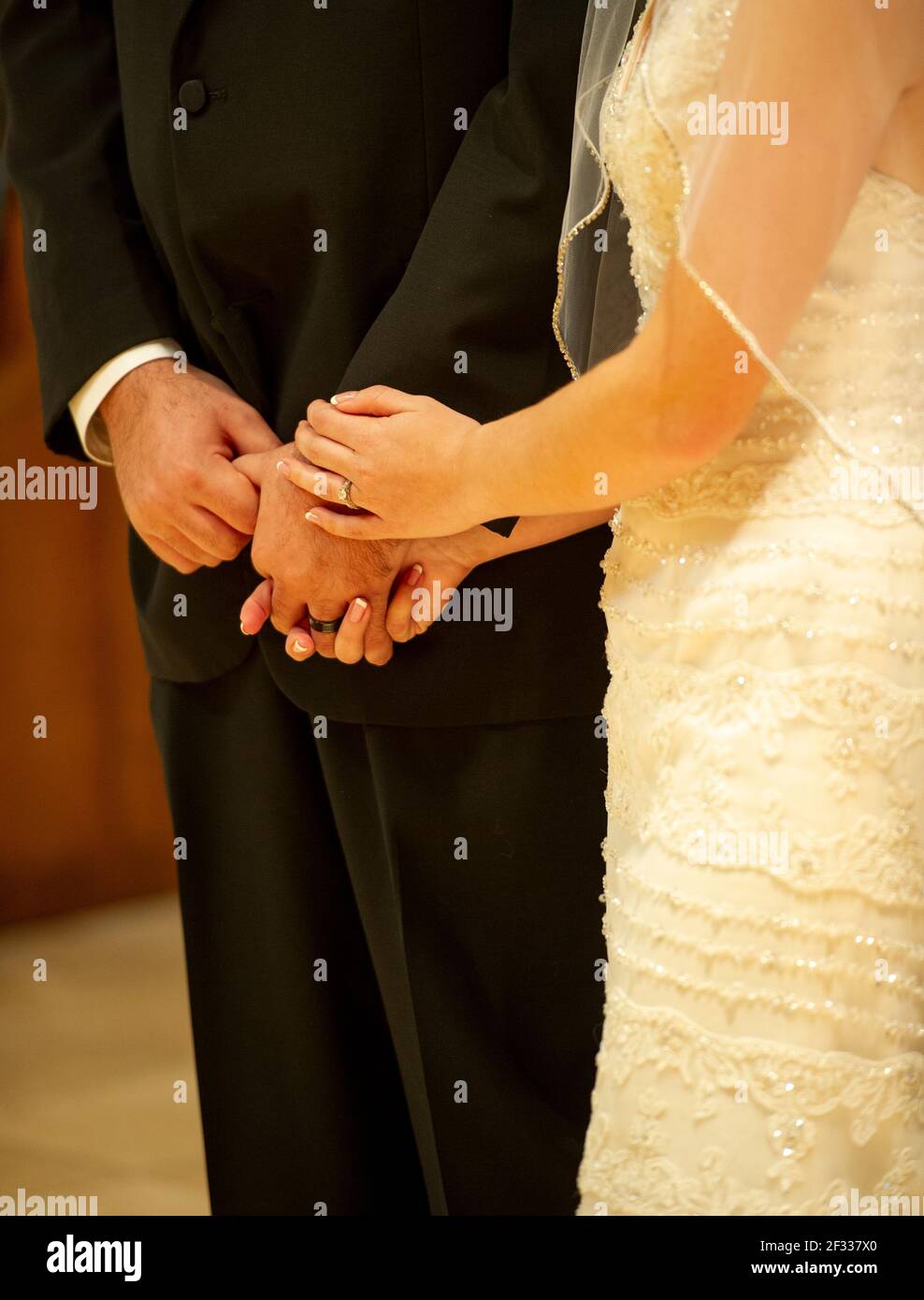 A bride and groom during their wedding ceremony Stock Photo - Alamy