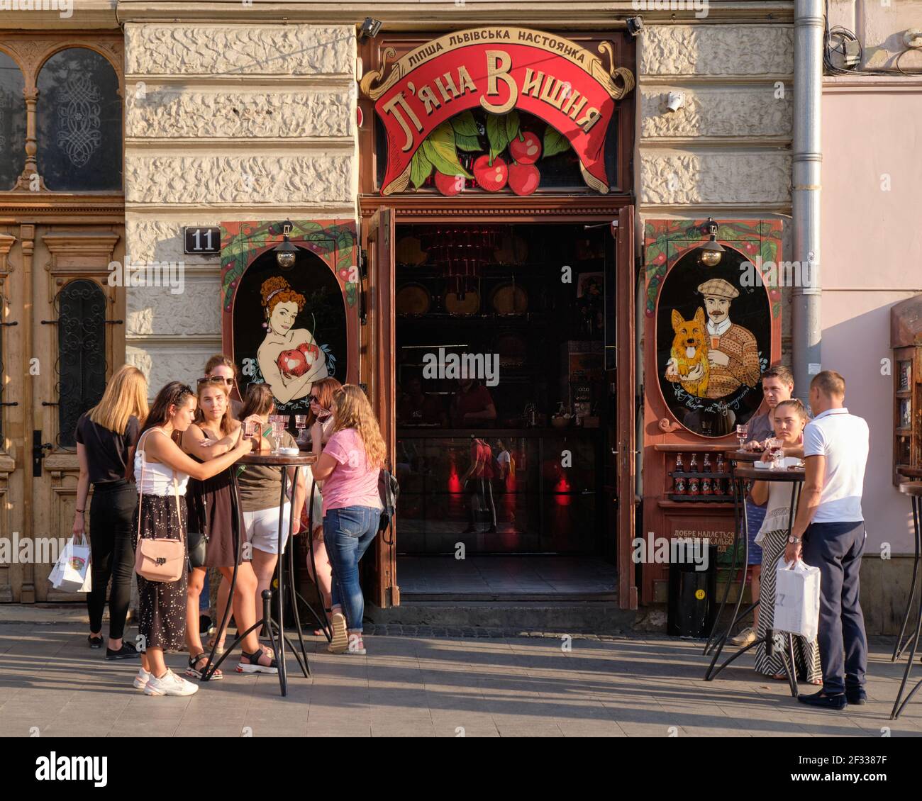 People drinking outside a Piana Vyshnia Cafe in Lviv, Ukraine. The ...