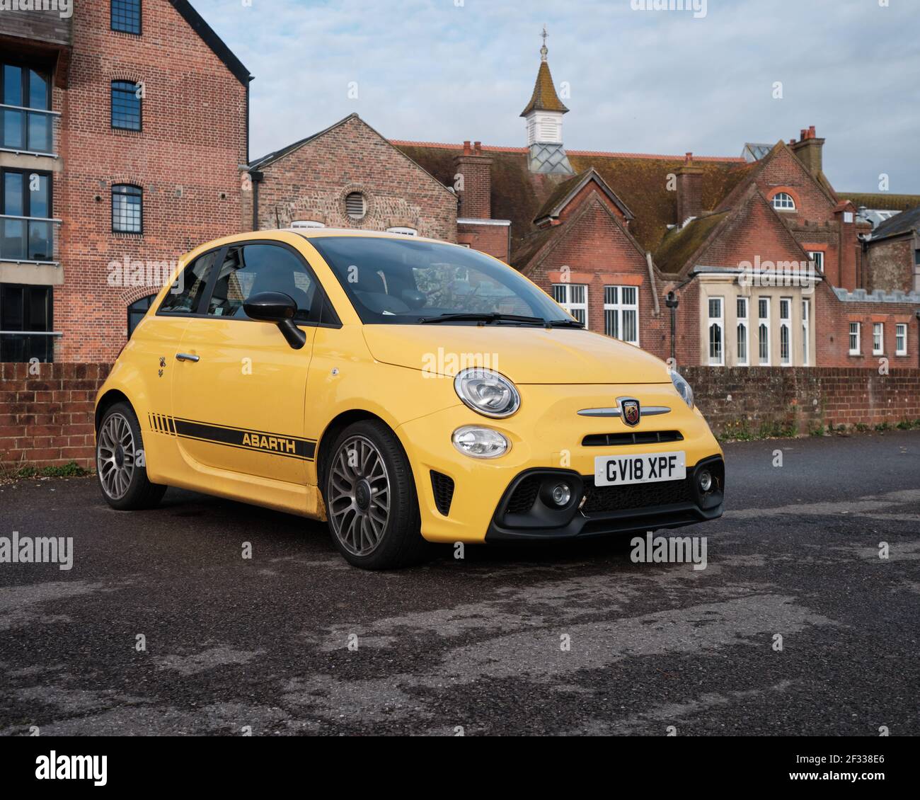Yellow Abarth car parked in urban setting in England Stock Photo - Alamy