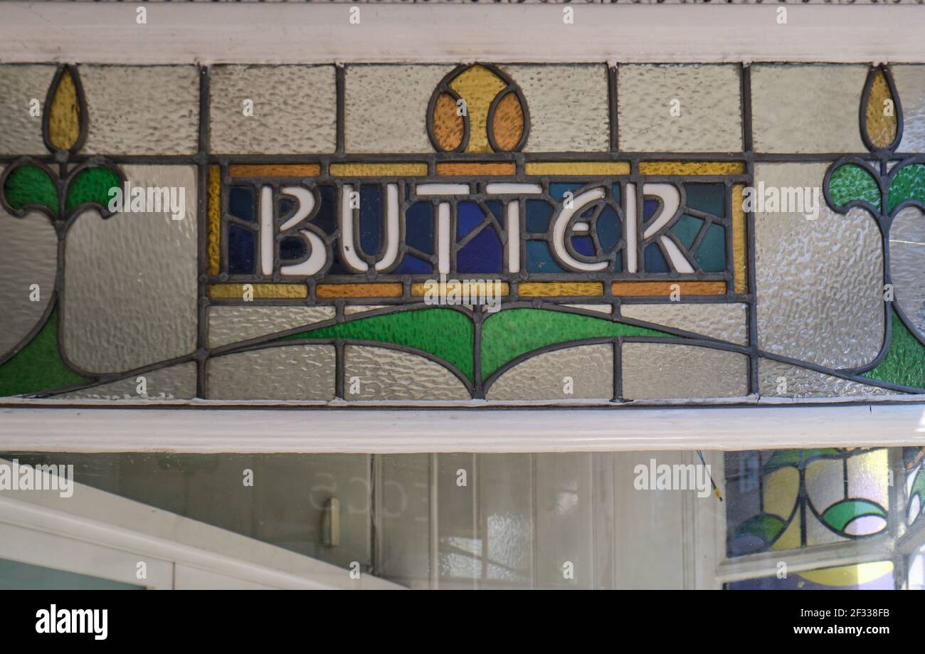 Store stained glass window with word "Butter Stock Photo - Alamy