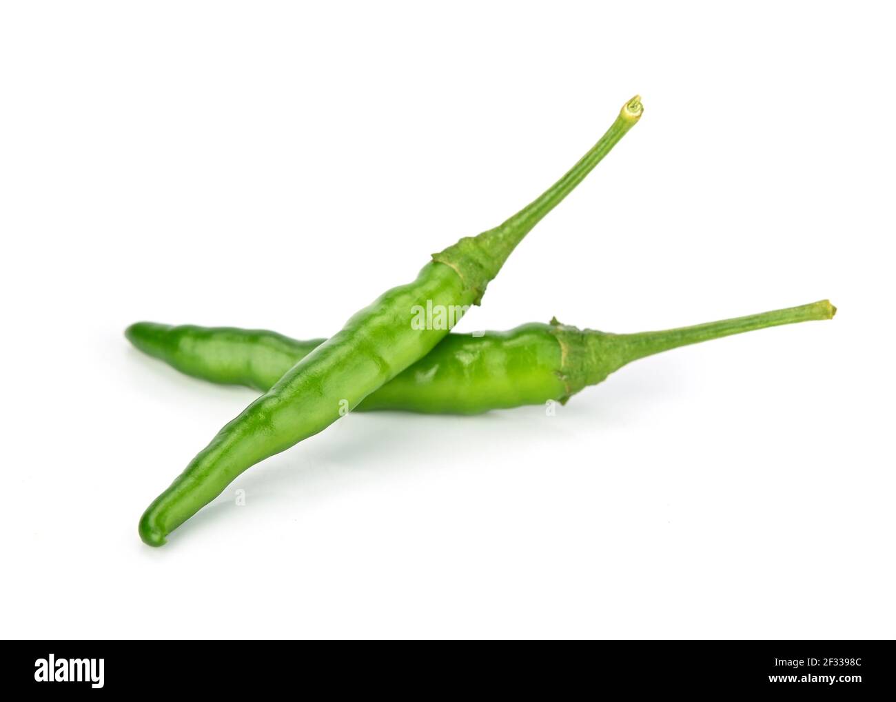 Close up of fresh green chili isolated on white background Stock Photo ...