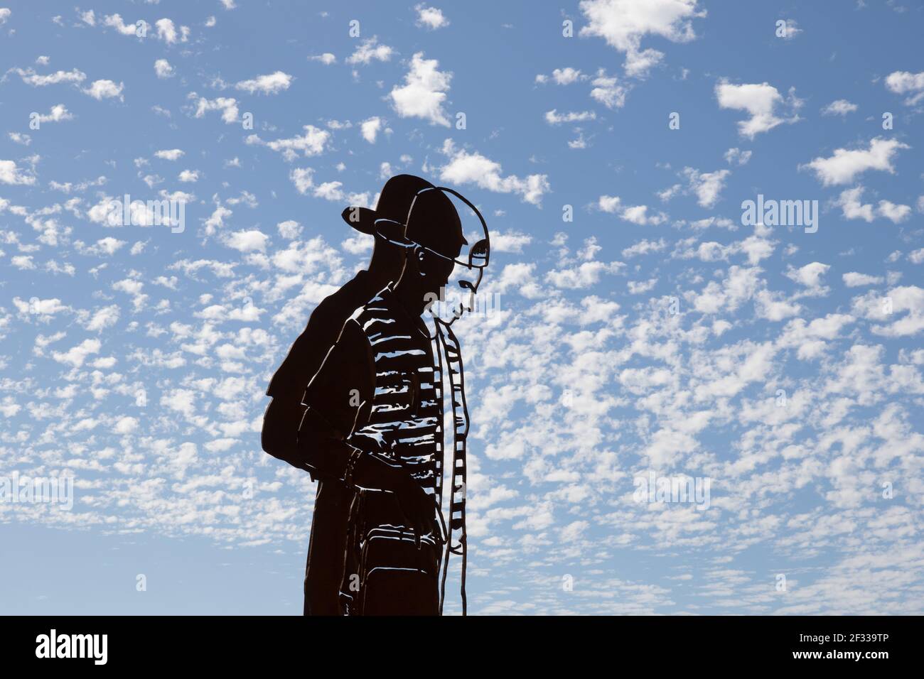 Landscape view of Human Sculpture with Blue Sky and Clouds Stock Photo ...