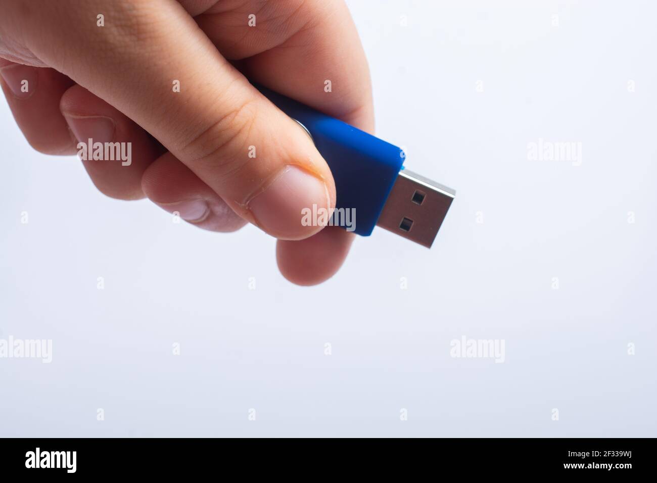 USB flash memory in hand with white background Stock Photo - Alamy