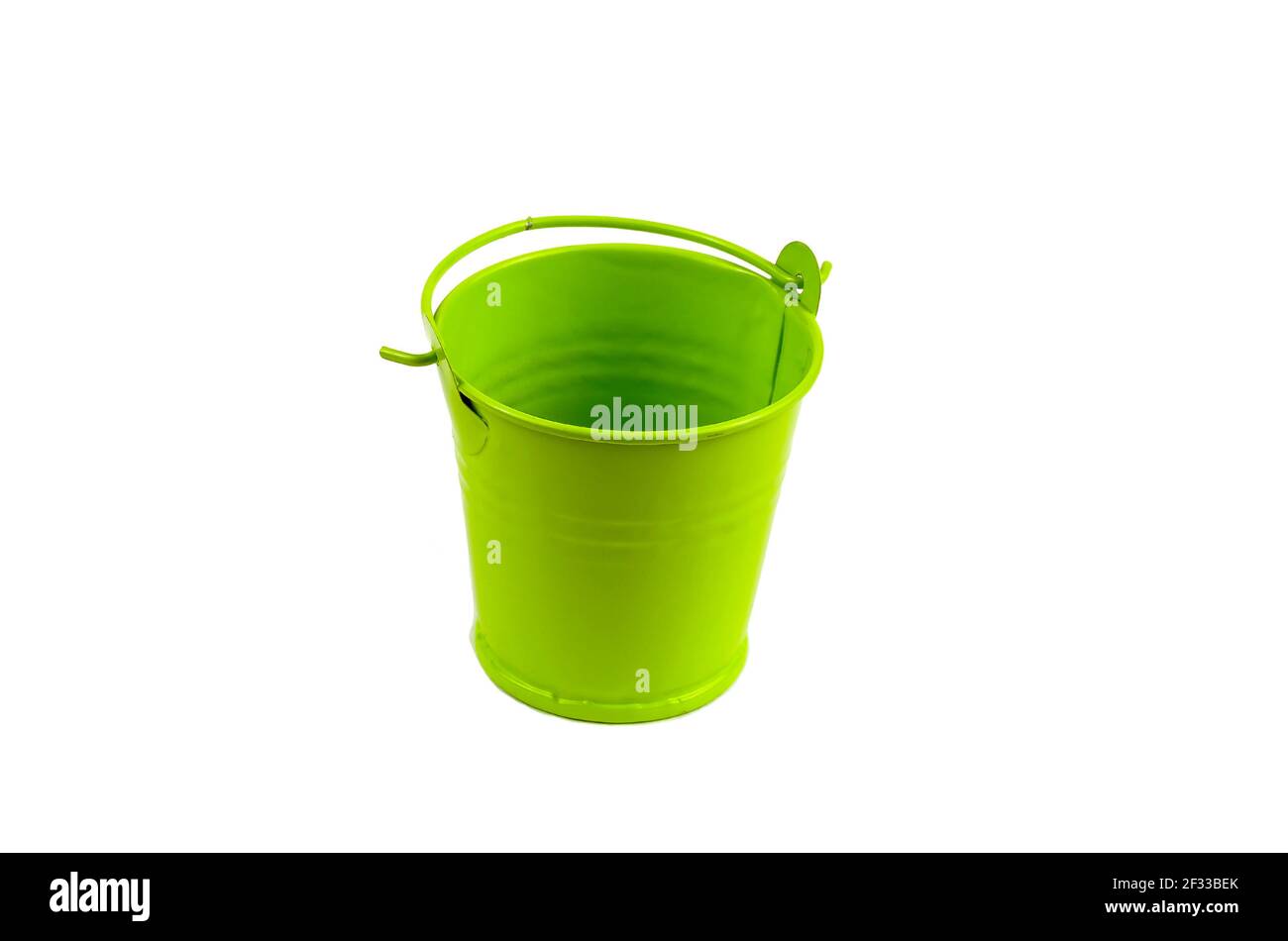 Empty green metal bucket on a white background. An bucket with a handle ...