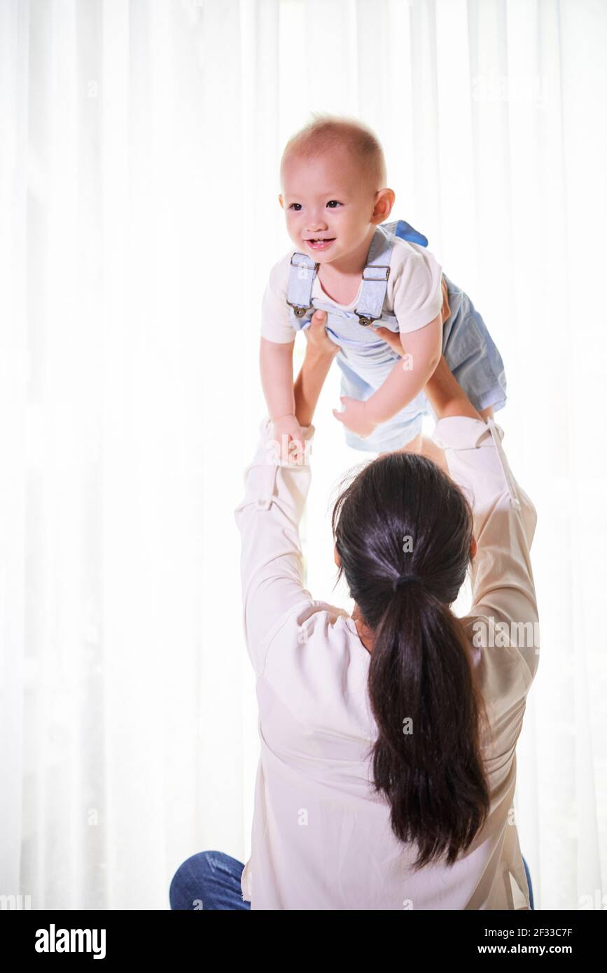 Mom son lifting hi-res stock photography and images - Alamy