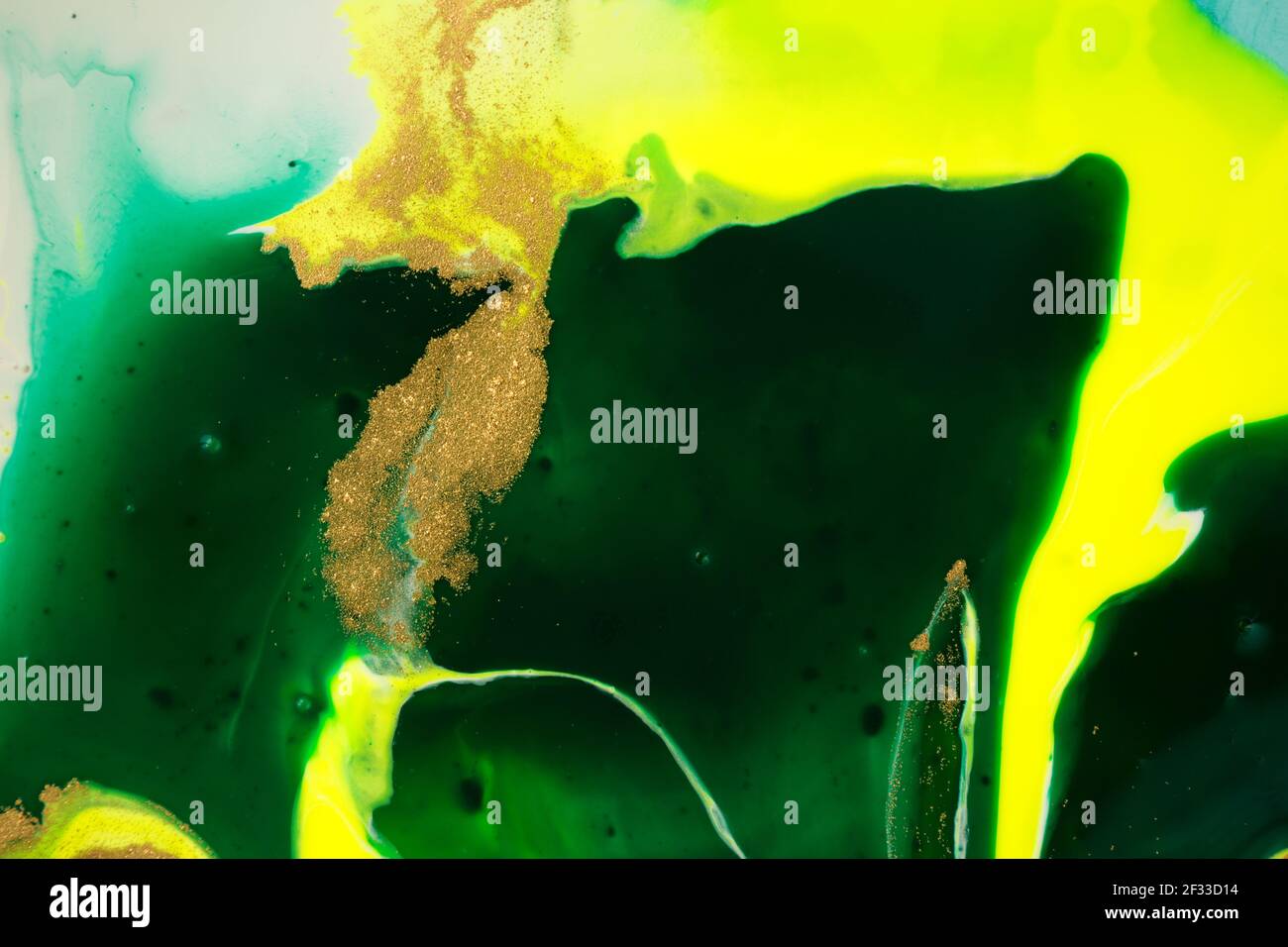 Green and yellow acrylic paints with gold glitter Stock Photo - Alamy