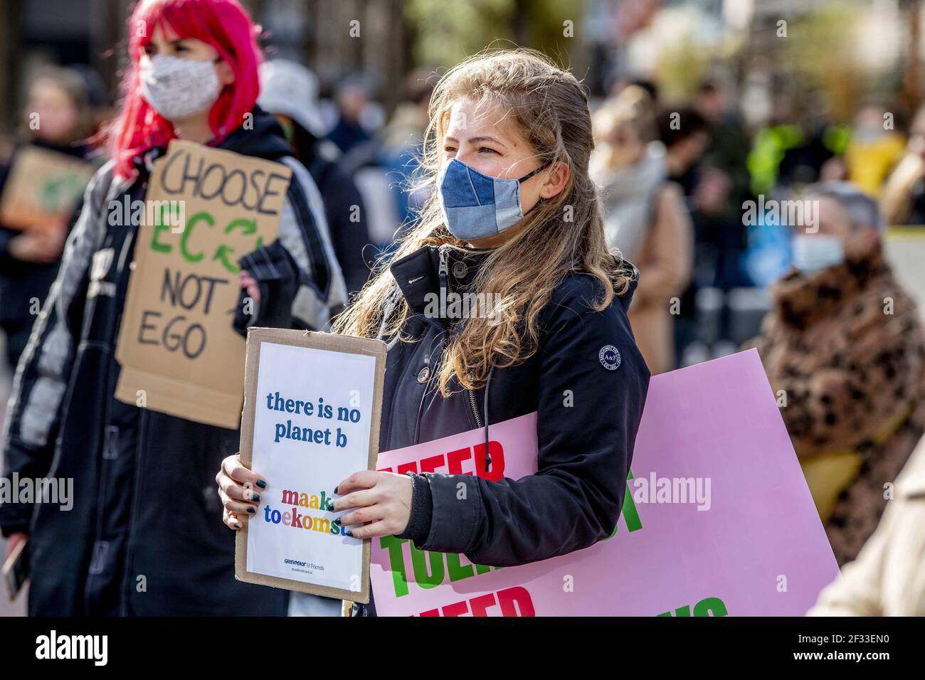 People gather for a climate alarm protest on March 14, 2021 in ...