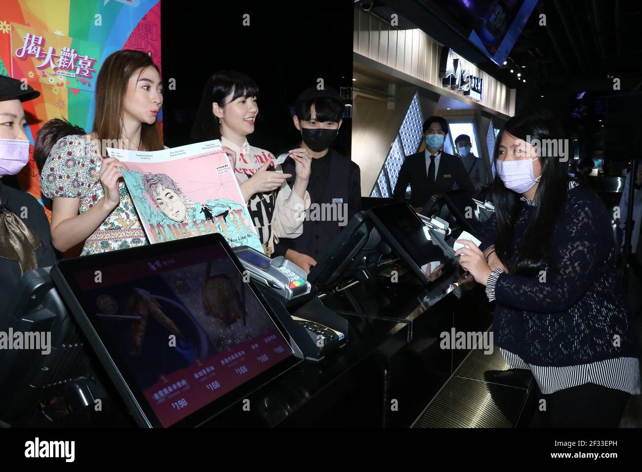 Taipei. 13th Mar, 2021. Puff Kuo and Aggie Hsieh work at the cinema as ...