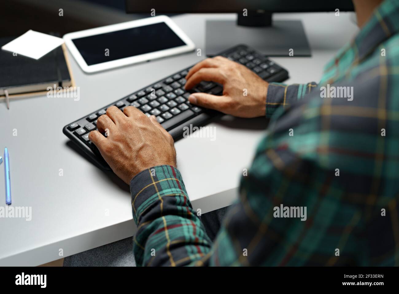 Black man hands typing on computer keyboard Stock Photo - Alamy
