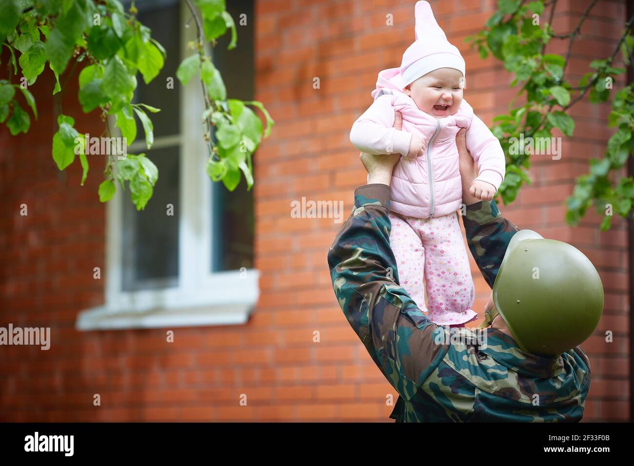 Military father came from the war or the exercises and cheerfully ...