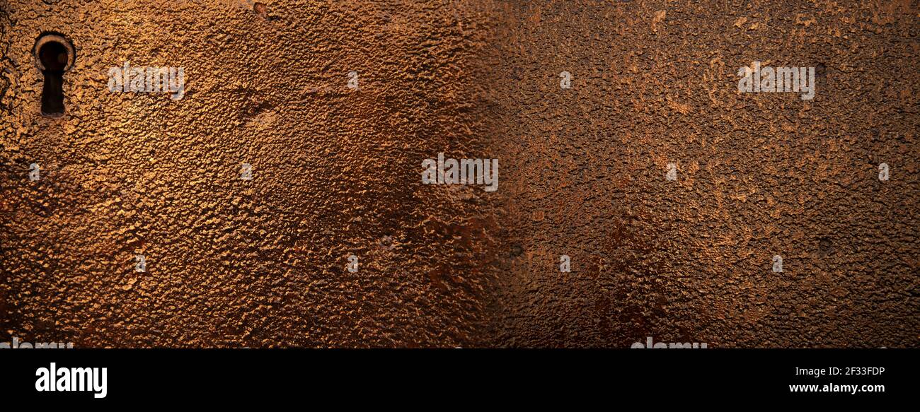 rough texture of rustic metal wall with key hole banner background ...