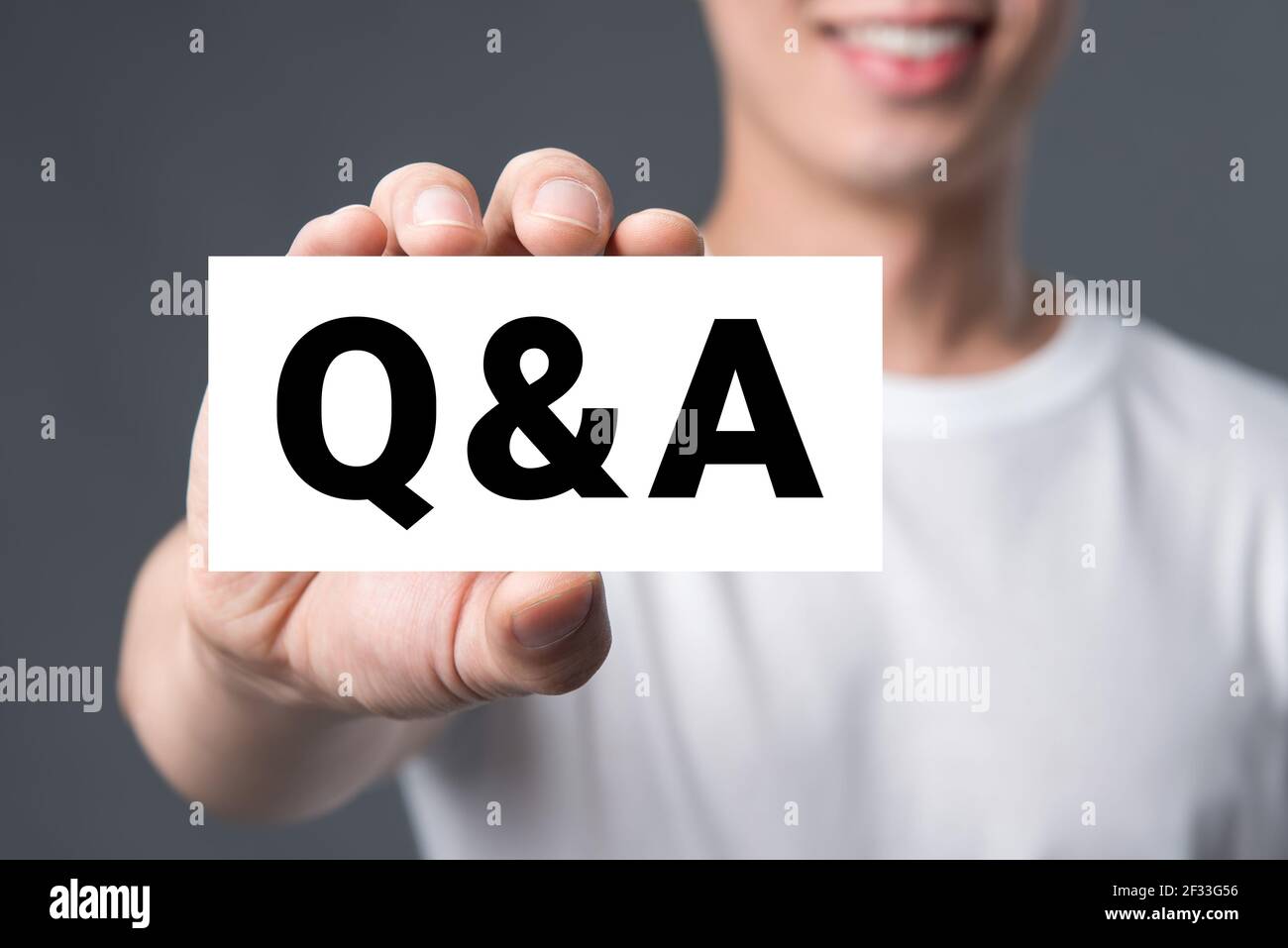 Q & A letters (or questions and answers) on the card shown by a man ...