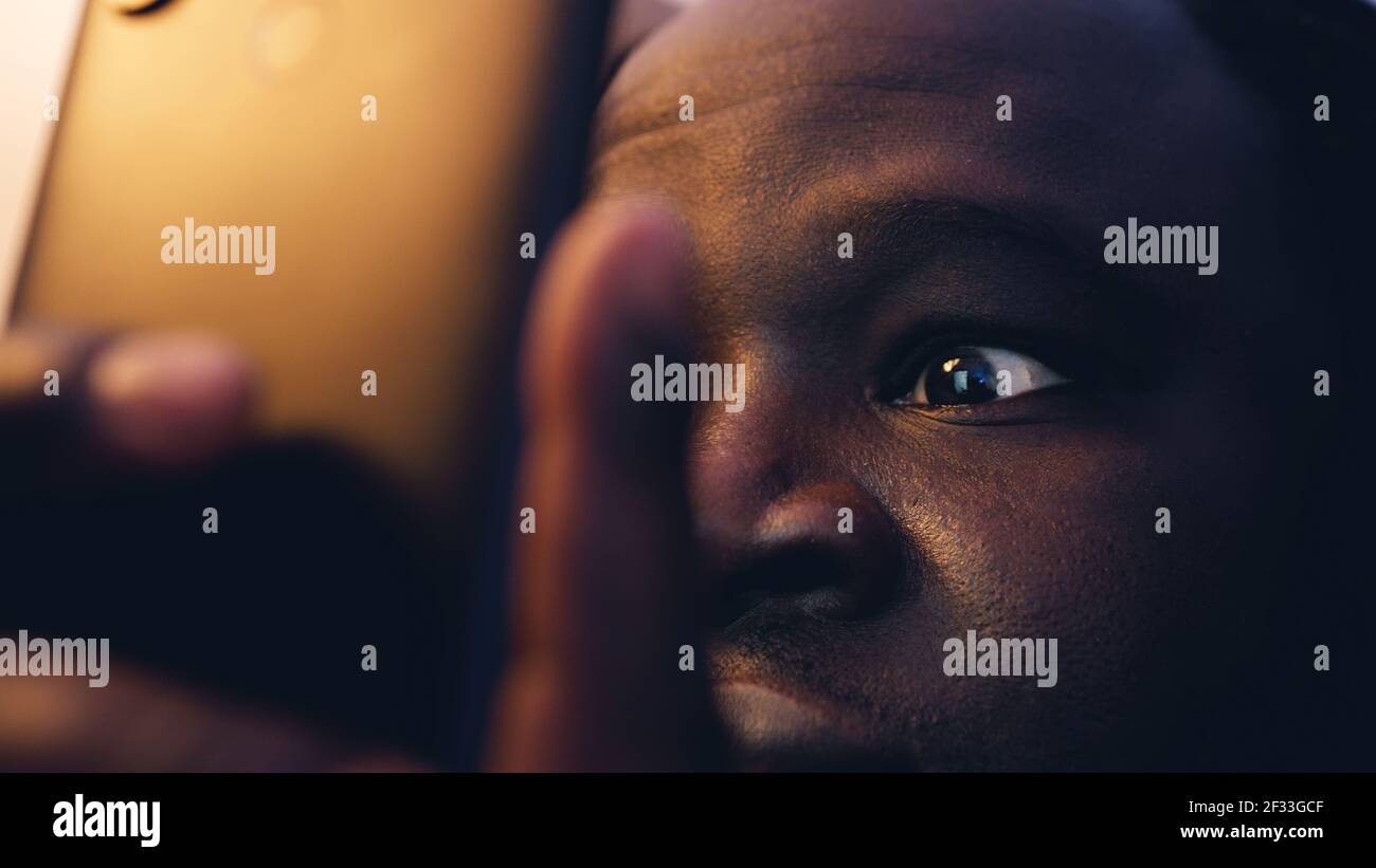 Close up Black man browsing news in shock. High quality photo Stock ...